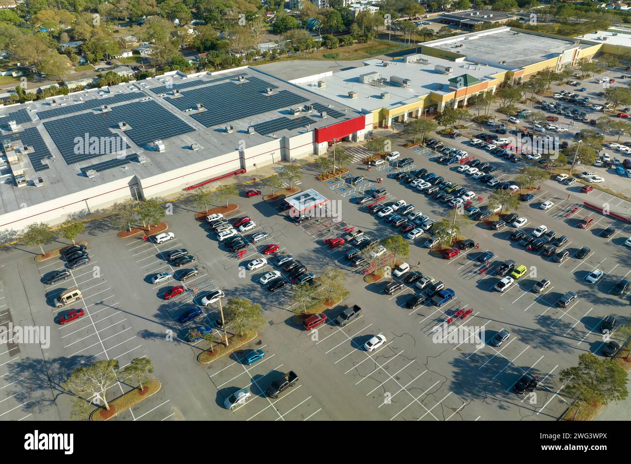 Many parked cars on store parking lot with lines and markings for ...