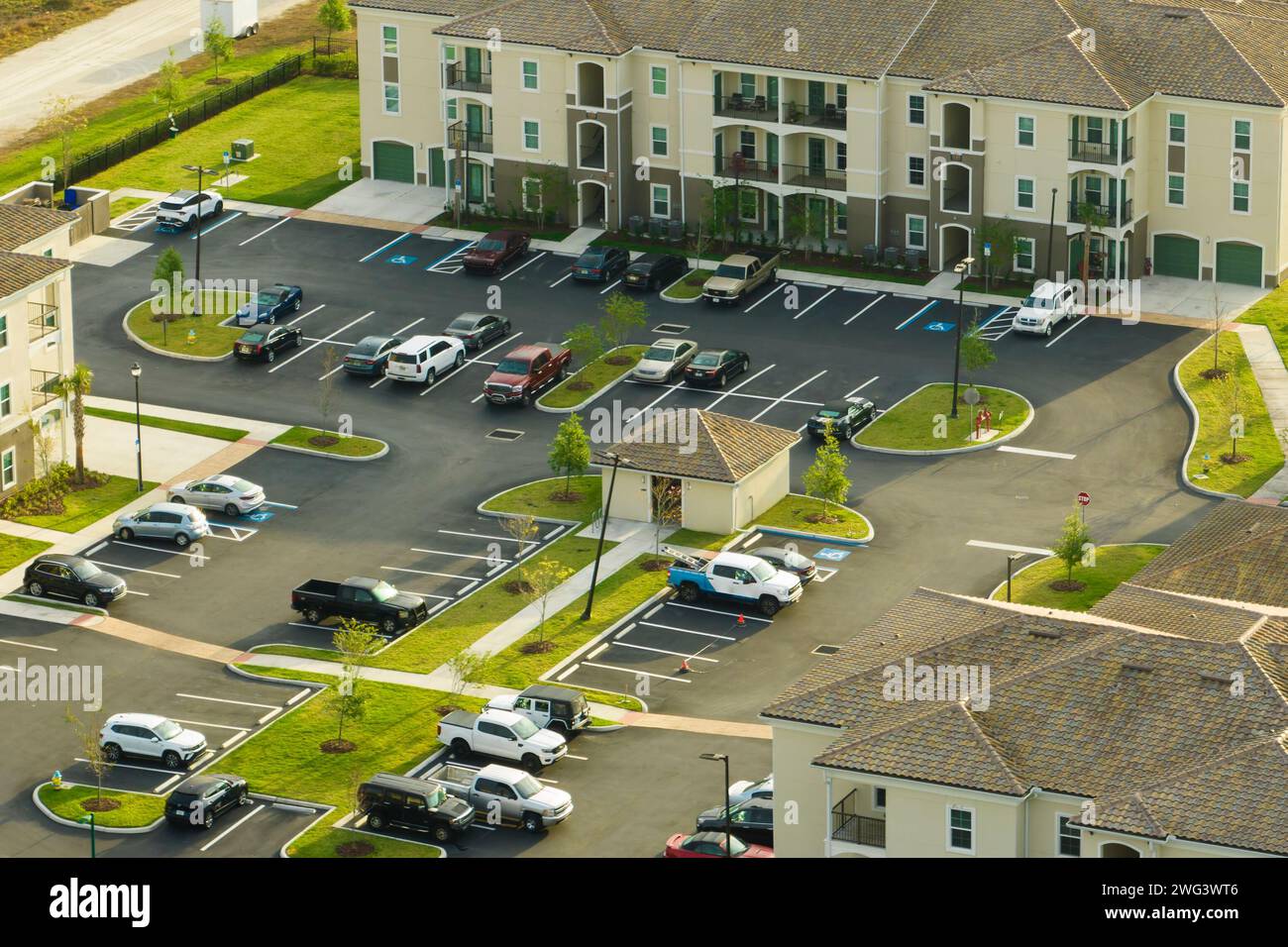 Aerial view of cars parked on parking places at american apartment ...
