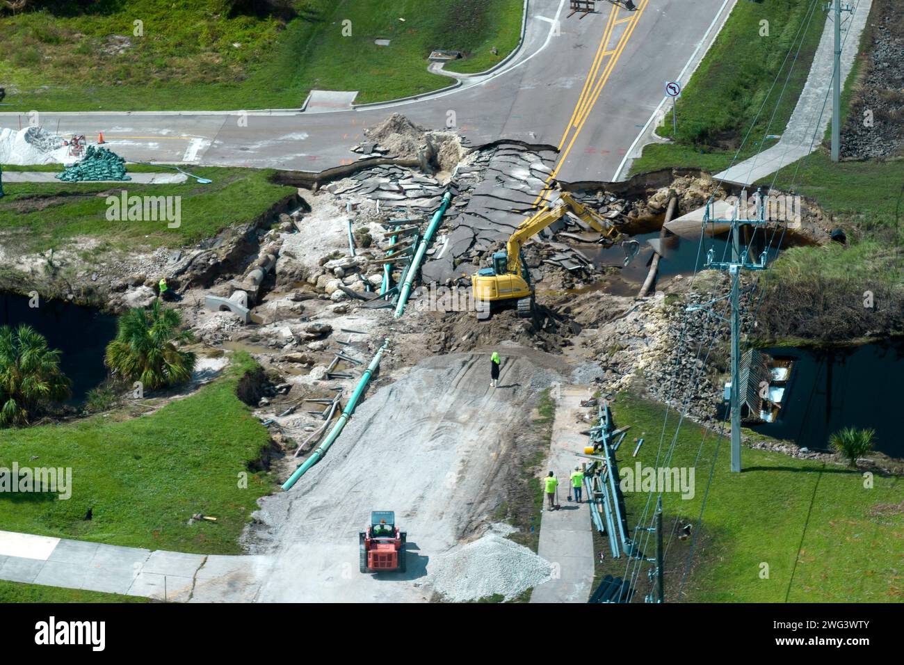 Construction equipment at roadworks site. Reconstruction of damaged ...