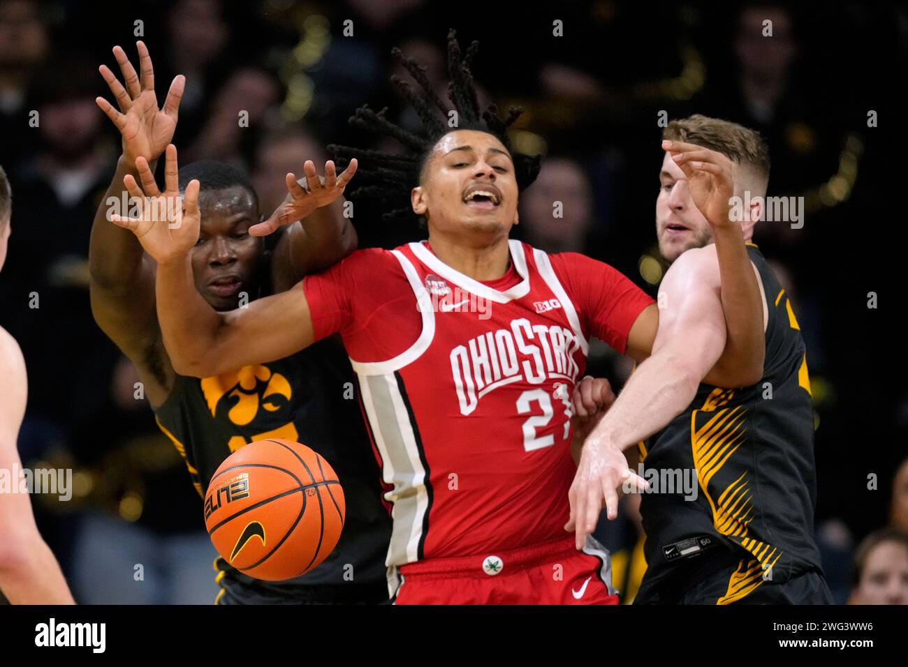 Ohio State forward Devin Royal (21) fights for a rebound with Iowa ...