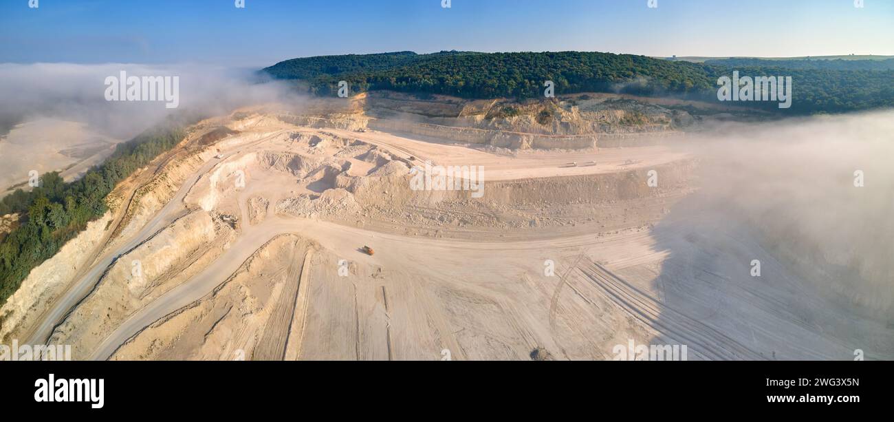 Aerial view of open pit mining of limestone materials for construction ...