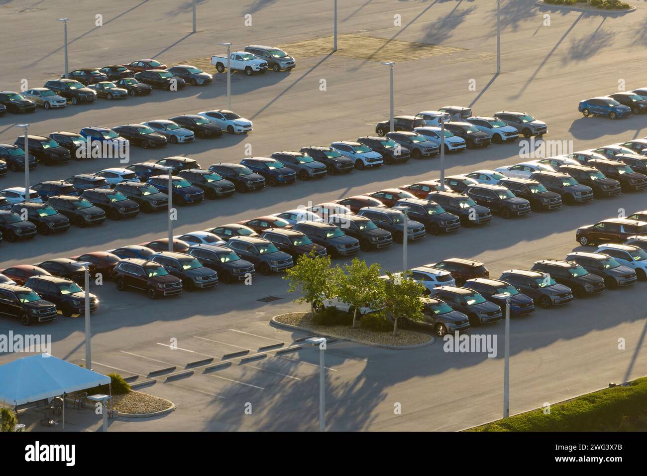 Large parking lot of local dealer with many brand new cars parked for ...