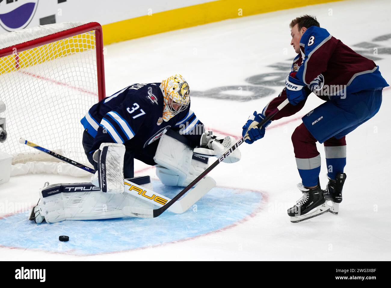 Winnipeg Jets goaltender Connor Hellebuyck (37) stops Colorado ...