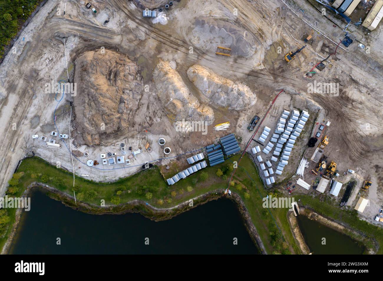 Construction site with building equipment on prepared ground in ...