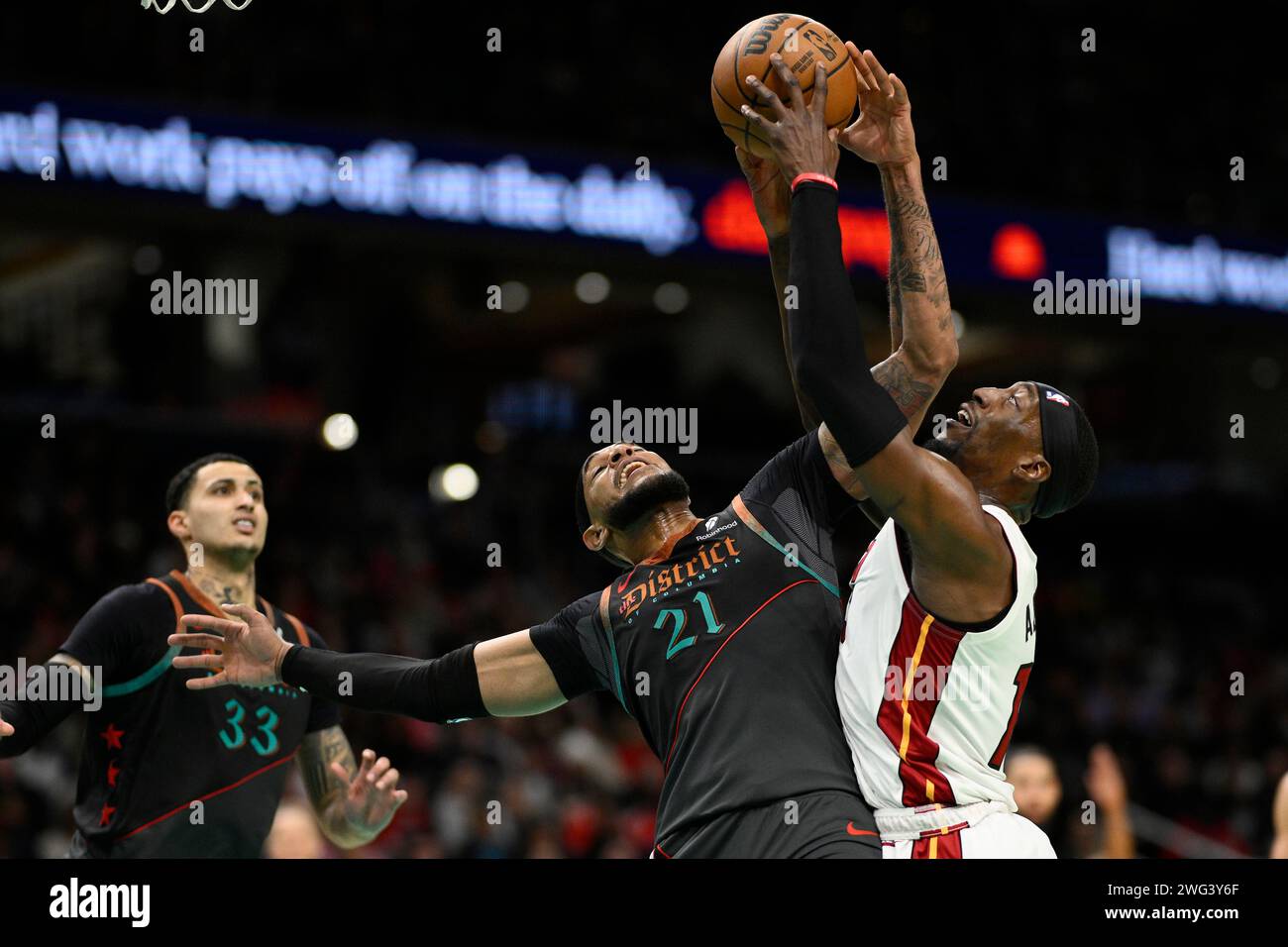 Washington Wizards center Daniel Gafford (21) and Miami Heat center Bam Adebayo (13) battle for ...