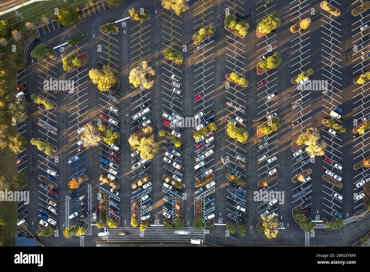 Large parking lot with many parked cars. Big carpark at supercenter ...