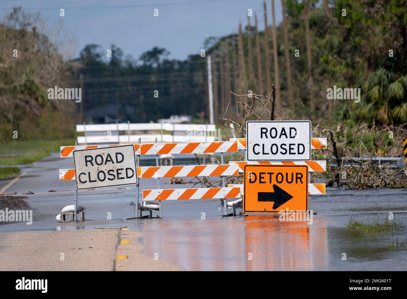 Hurricane flooded street with road closed signs blocking driving of ...