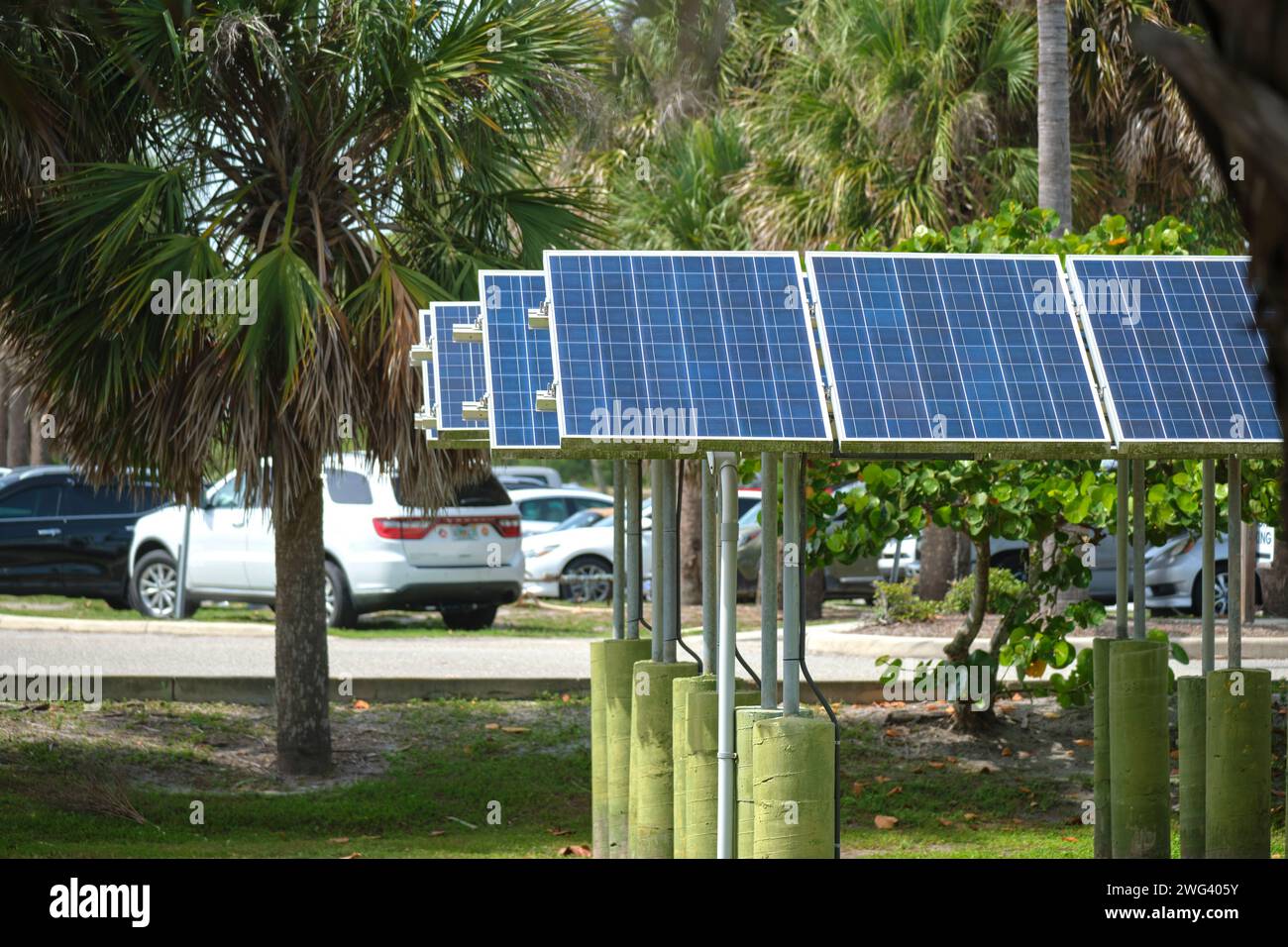 Solar panels installed on stand frame near parking lot for effective ...