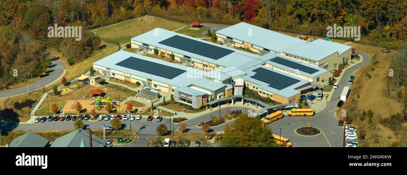 Aerial view of american school building with rooftop covered with ...