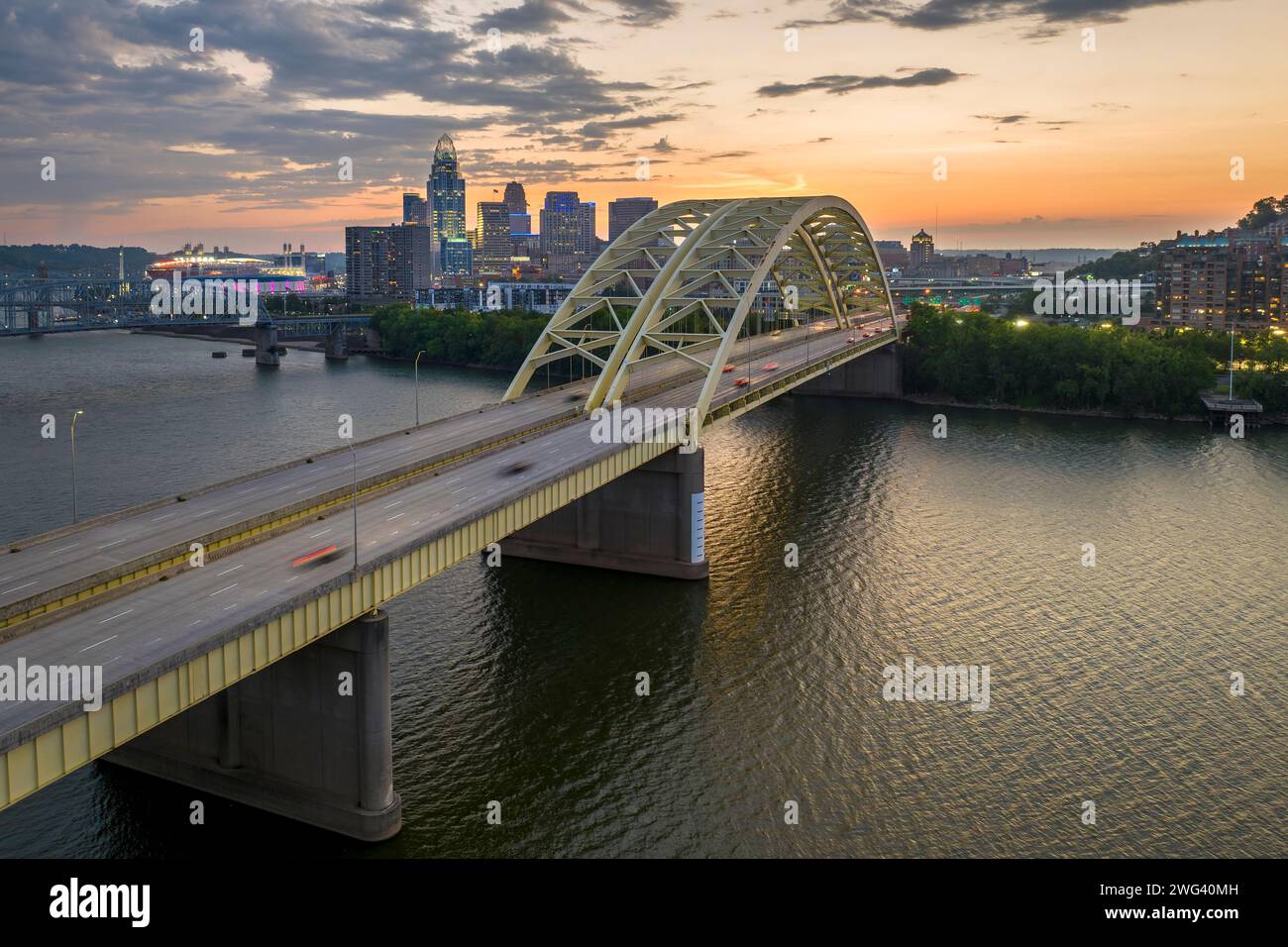 Downtown district of Cincinnati city in Ohio, USA at night with driving ...