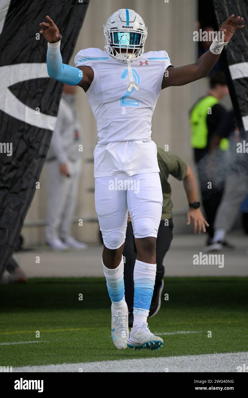 Team Ice linebacker Chris Cole (2) runs onto the field during player ...