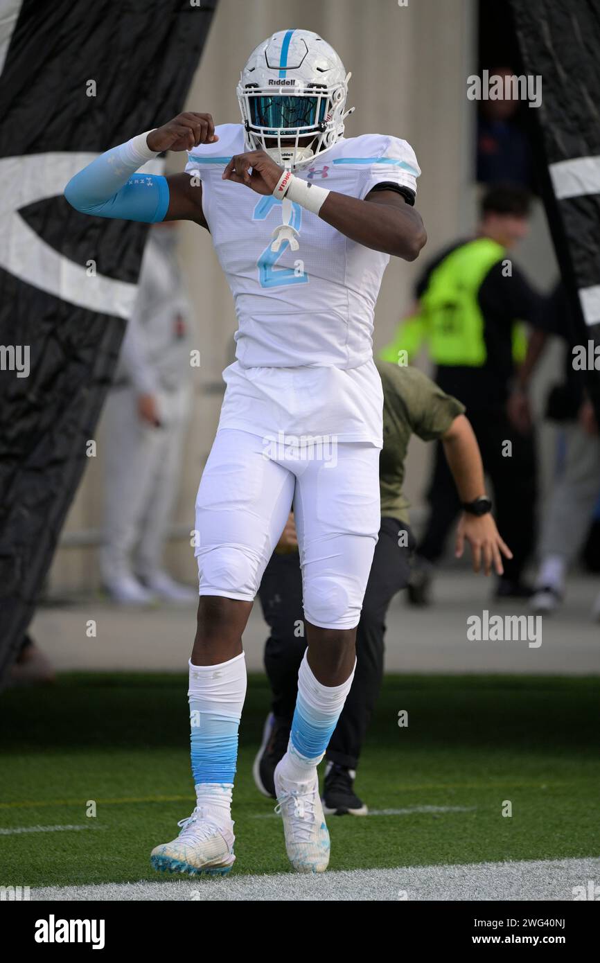 Team Ice linebacker Chris Cole (2) runs onto the field during player ...