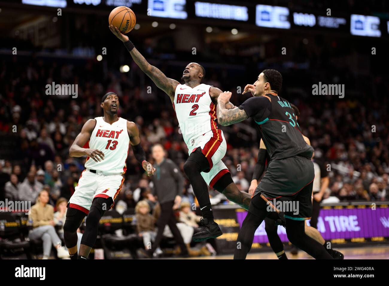 Miami Heat guard Terry Rozier (2) goes to the basket against Washington ...