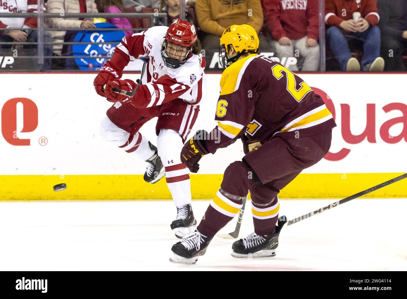 Wisconsin forward Owen Mehlenbacher (17) shoots the puck against ...