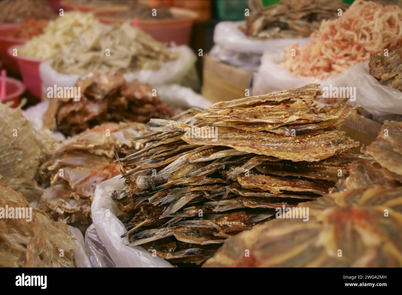 Assorted dried seafood displayed at the traditional local market ...