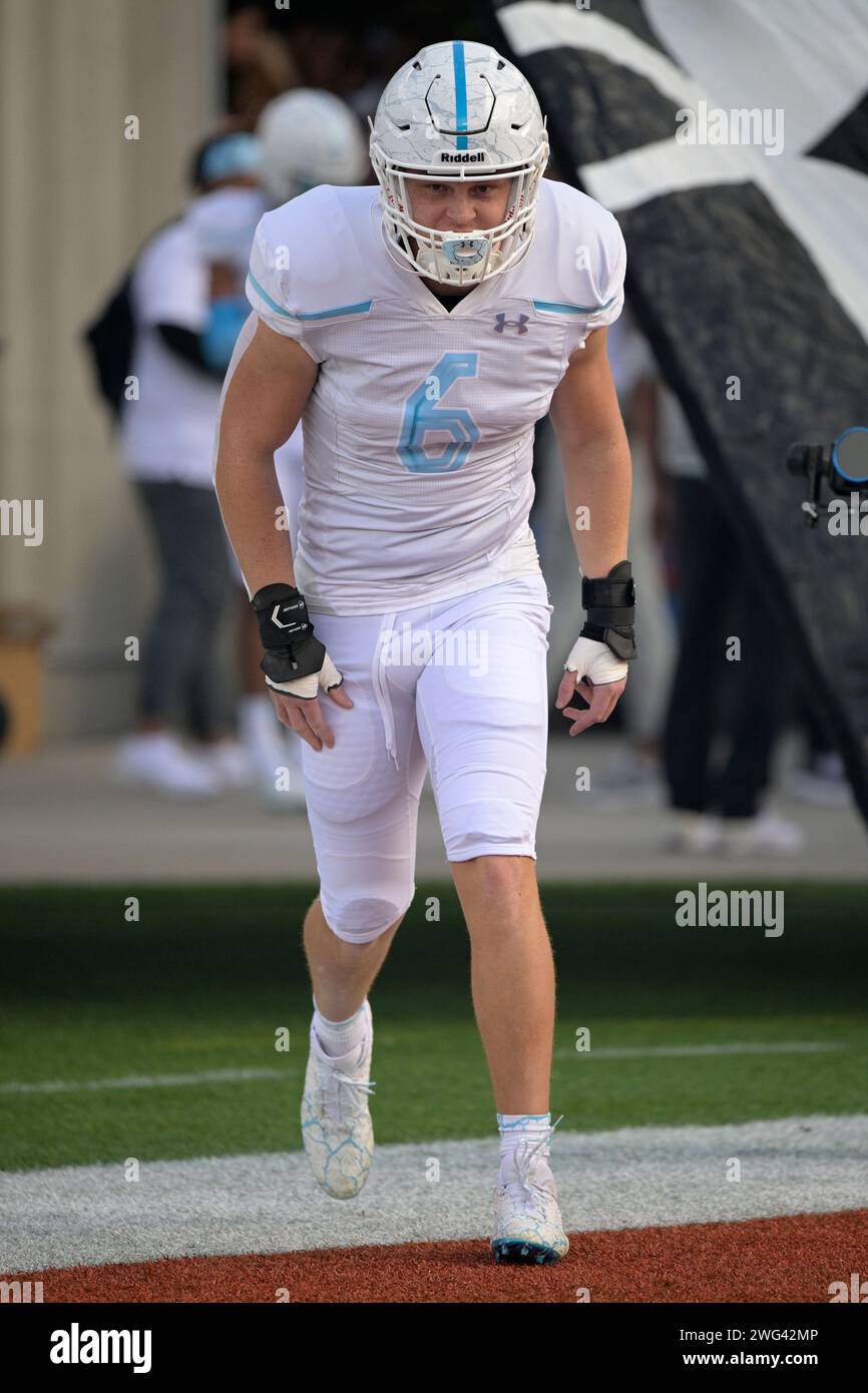 Team Ice linebacker Cayden Jones (6) runs onto the field during player ...