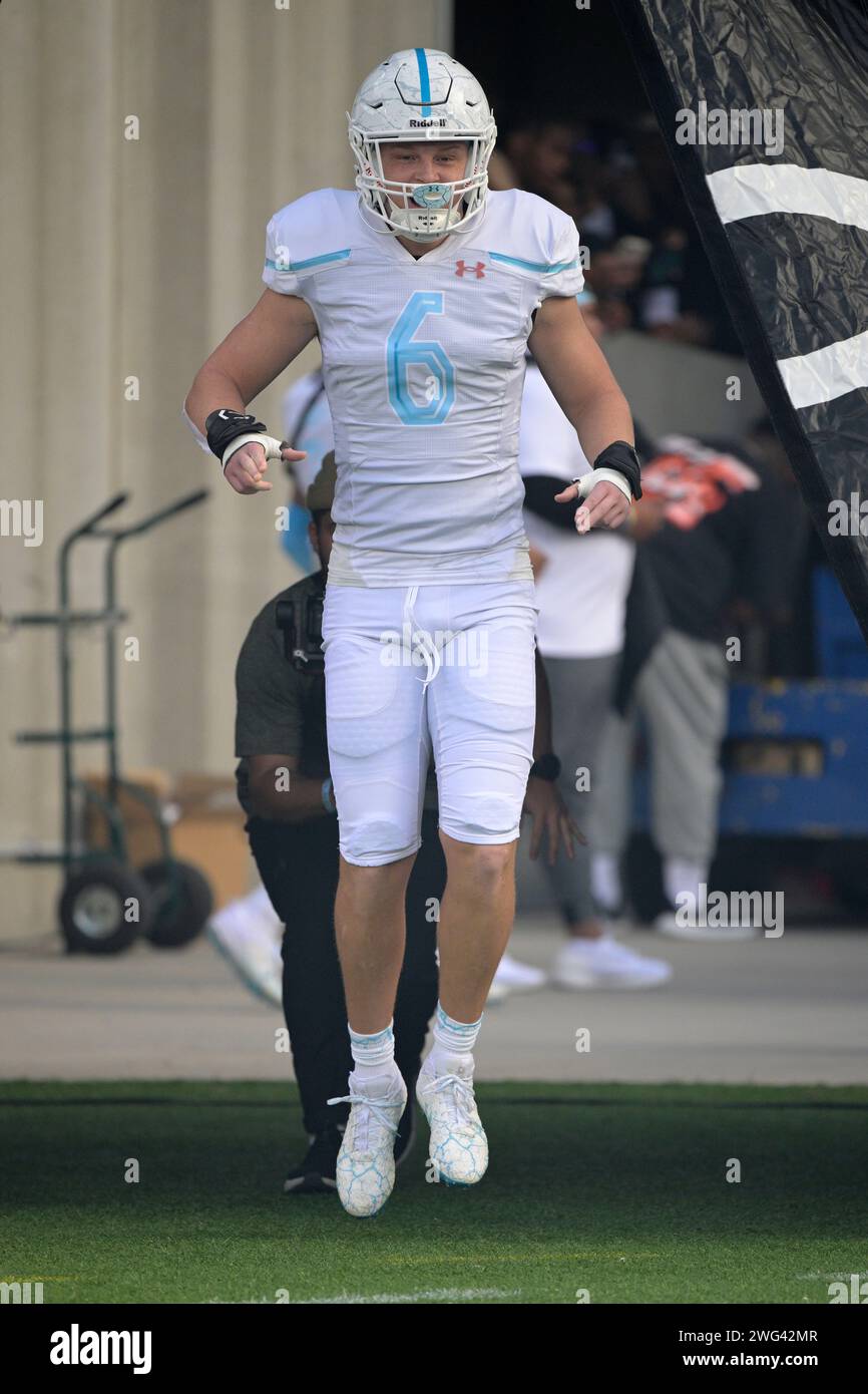 Team Ice linebacker Cayden Jones (6) runs onto the field during player ...