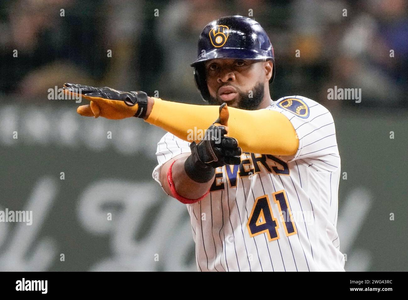 FILE - Milwaukee Brewers' Carlos Santana reacts after hitting an RBI ...