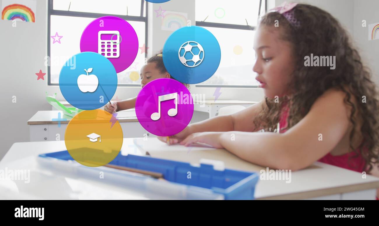 Image of school subject icons over happy diverse schoolgirls writing in ...