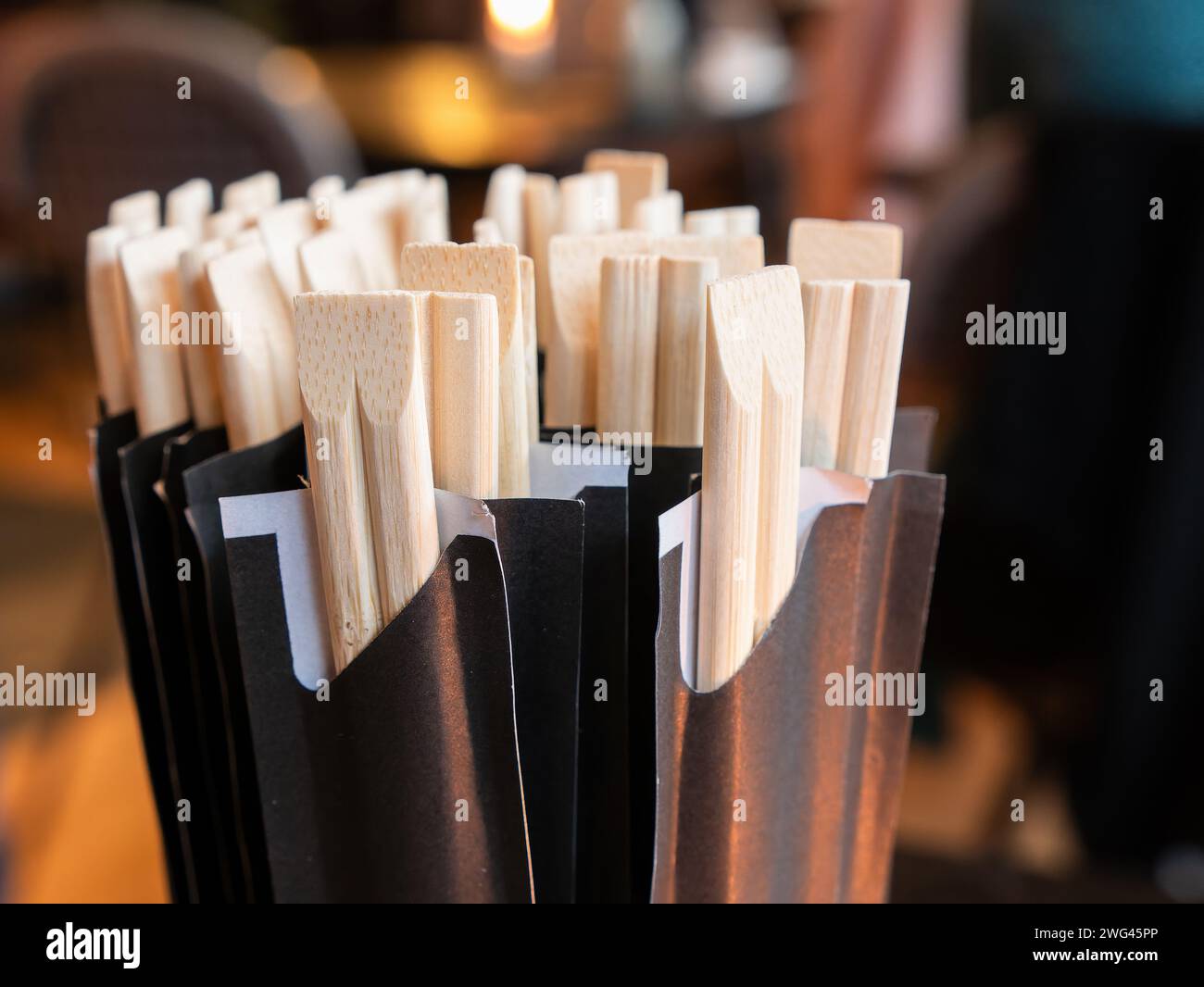 Disposable Japanese chop sticks at a restaurant table. Shallow depth of ...