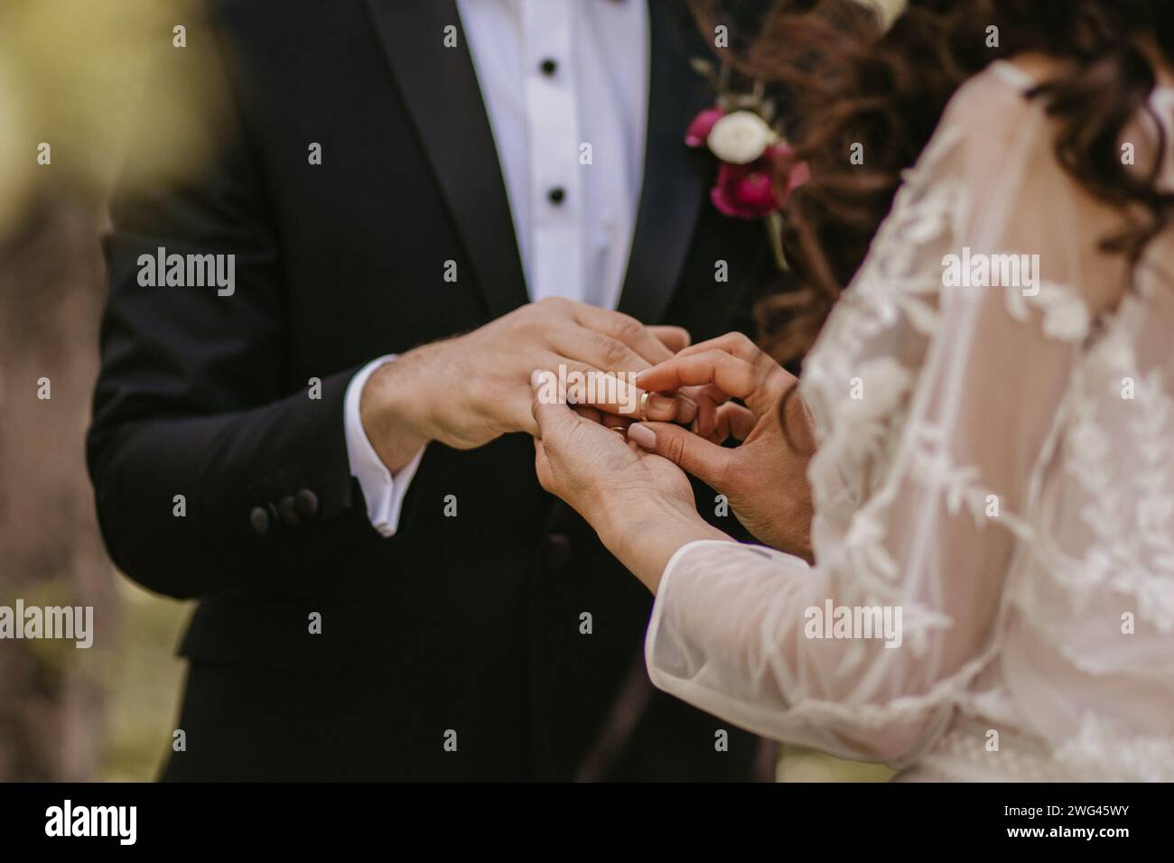 The bride and groom exchanging wedding rings during the ceremony Stock ...