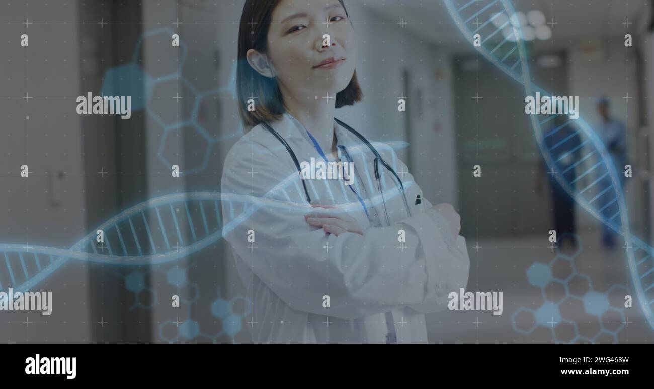 Image of dna strands over asian female doctor Stock Photo - Alamy