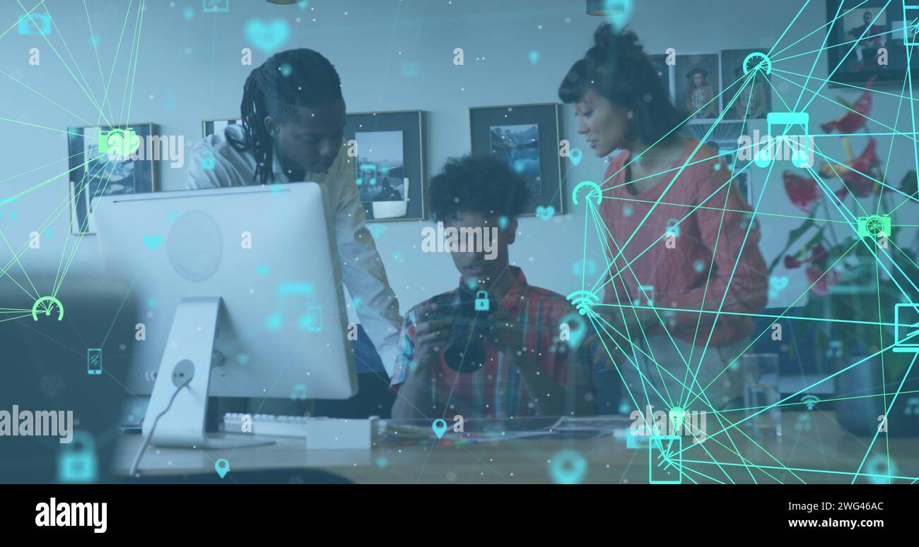 Image of network of connections with icons over diverse business people ...