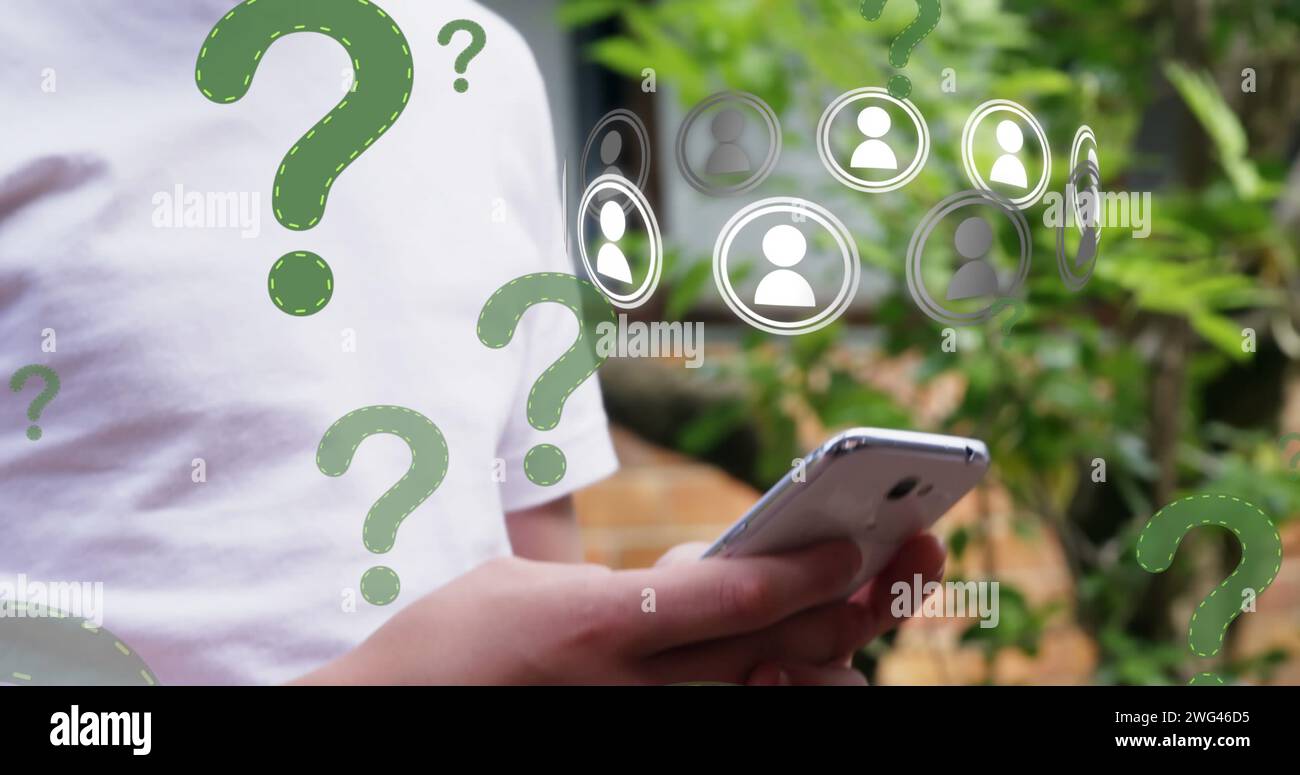 Question mark and profile icons floating against caucasian boy using ...