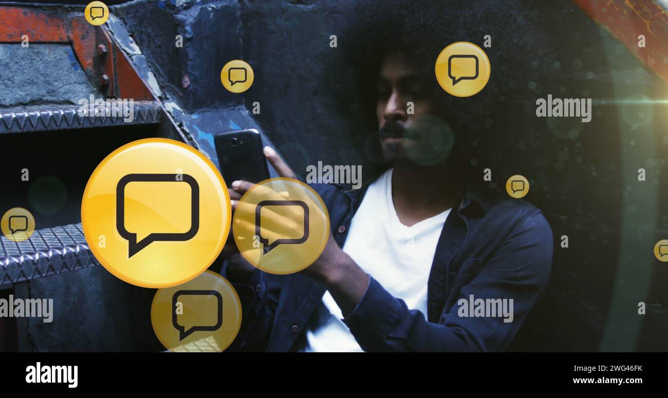 Multiple message icons floating against african american man using ...