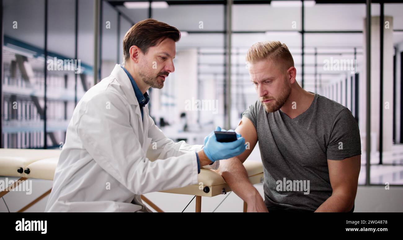 Doctor Testing Glucose Level With Continuous Glucose Monitor Stock ...