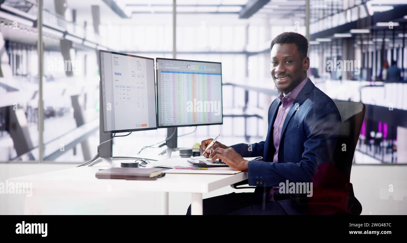 Data Analyst African Man Using Spreadsheet On Computer Stock Photo - Alamy