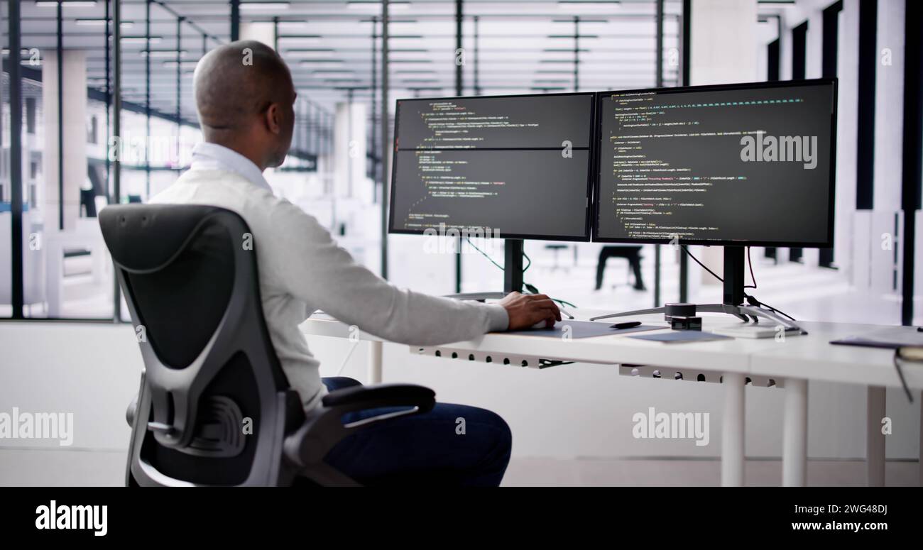 African American Coder Using Computer At Desk. Web Developer Stock Photo - Alamy