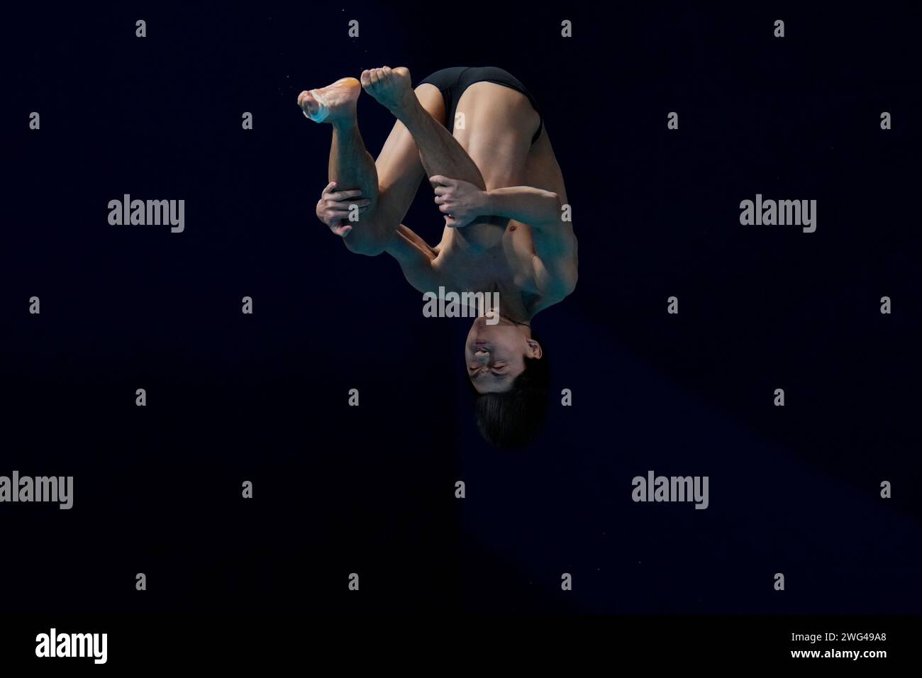 Jaegyeong Yi of South Korea makes a dive during the men's 1m ...