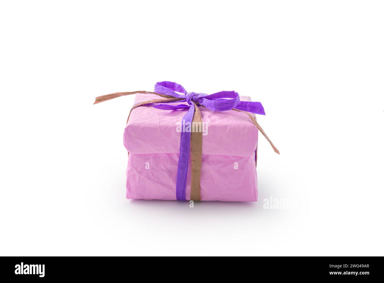 crumpled paper pink present box with recycled paper ribbon isolated on ...