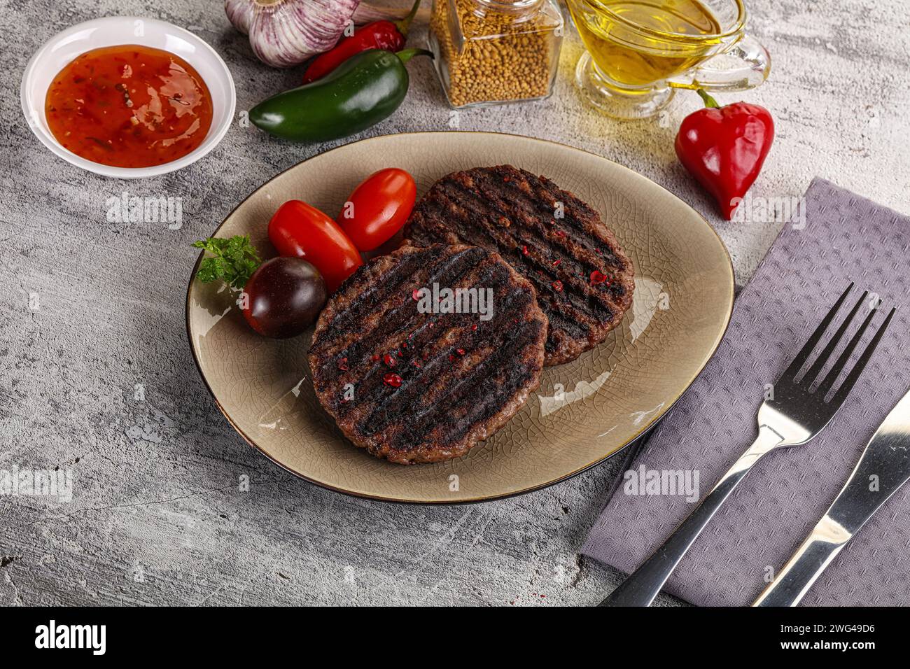 Grilled beef burger cutlet with sauce Stock Photo - Alamy
