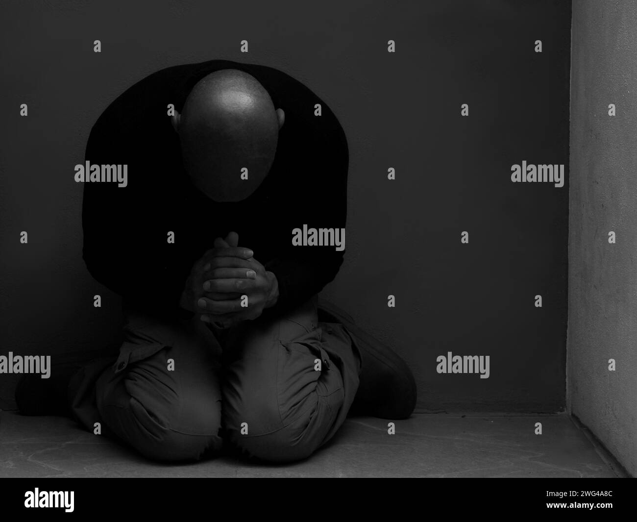black man praying to god with hands together Caribbean man praying with ...