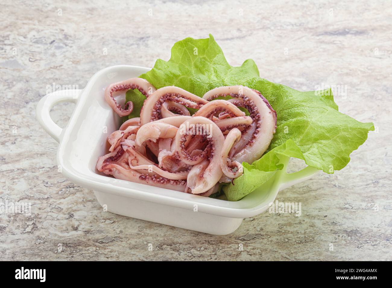 Marinated squid kalamri tentacles in the bowl Stock Photo - Alamy