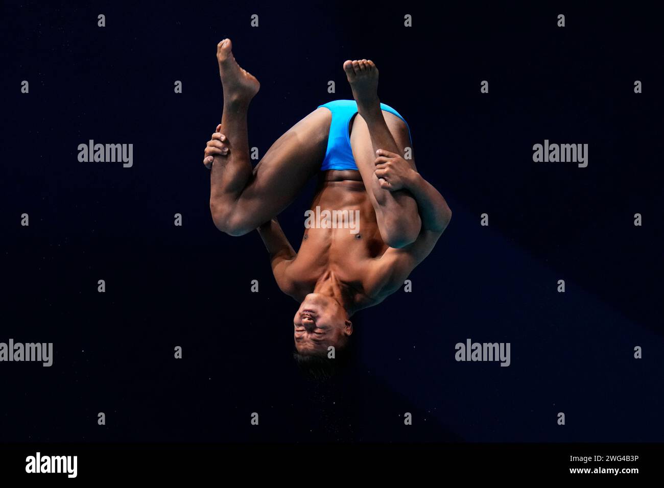 London Singh Hemam of India makes a dive during the men's 1m ...