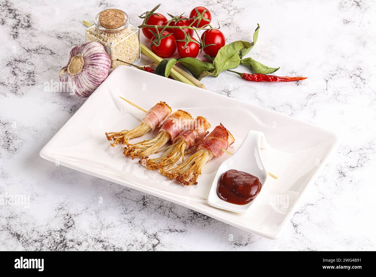 Tasty Grilled enoki mushroom with bacon Stock Photo - Alamy