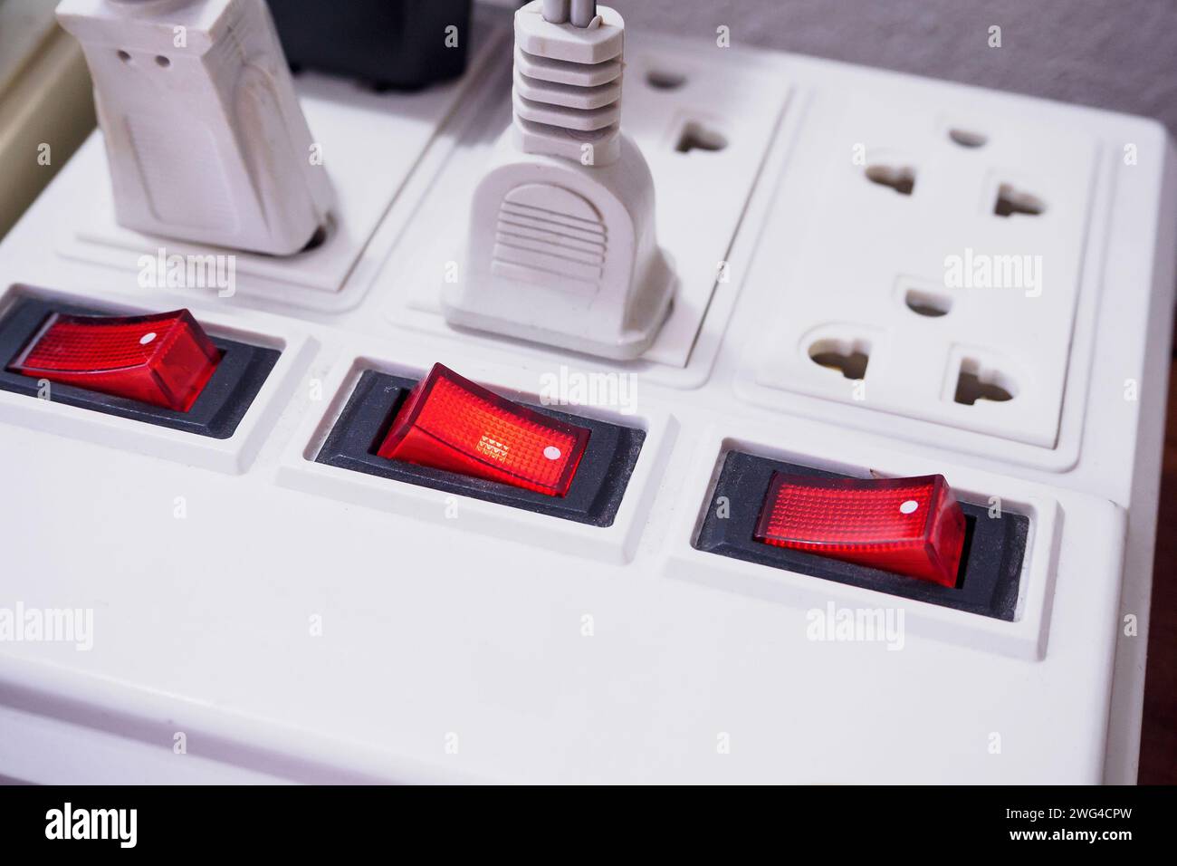 Multiple power socket with connected plugs Stock Photo - Alamy