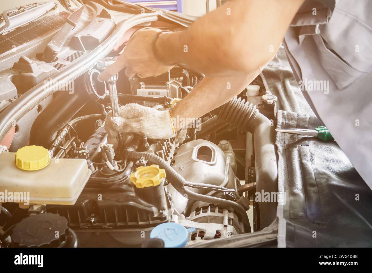 Mechanic with wrench working and repair car engine in car service ...