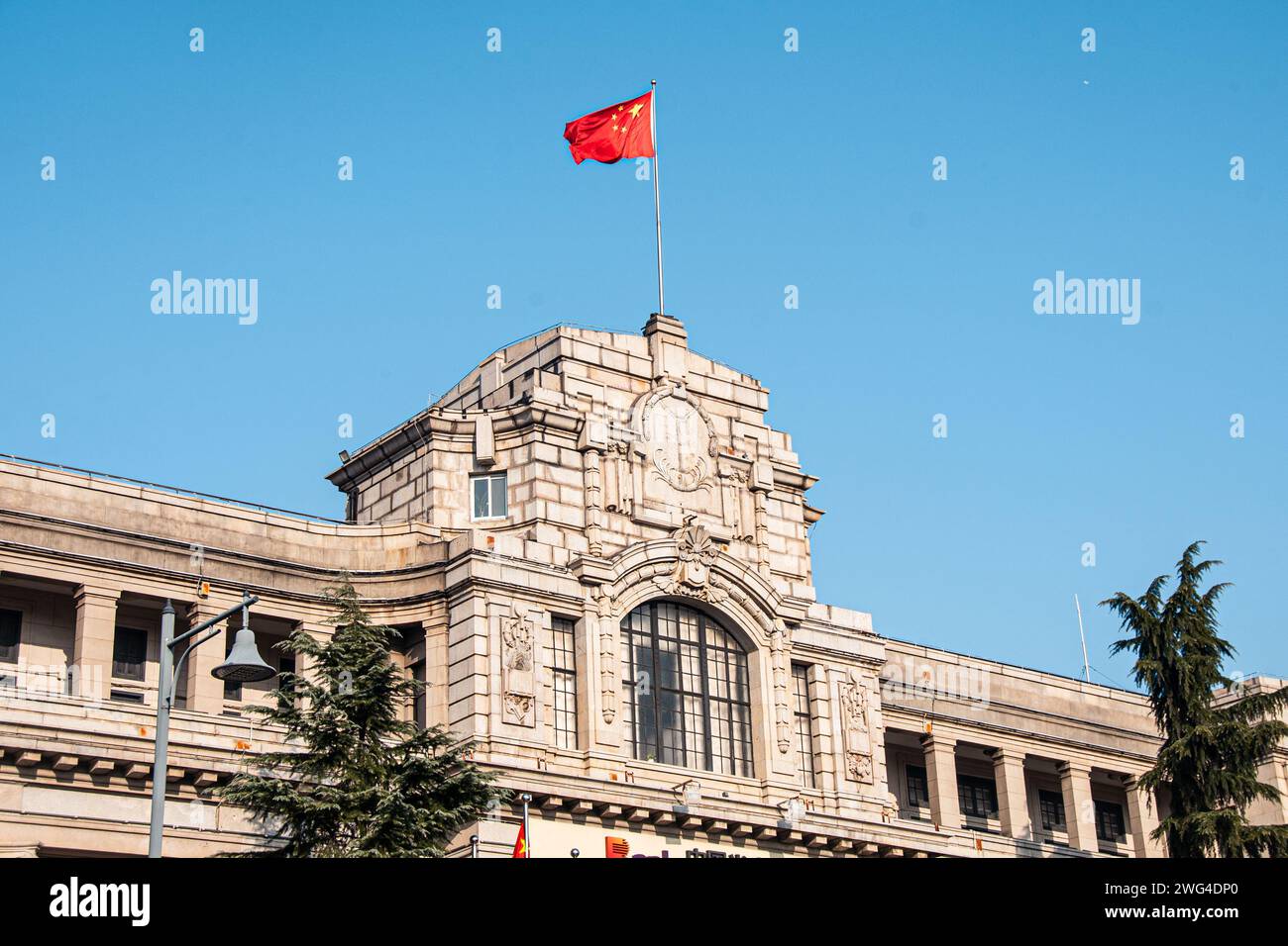 A stone building with a Chinese flag in Wuhan Stock Photo - Alamy