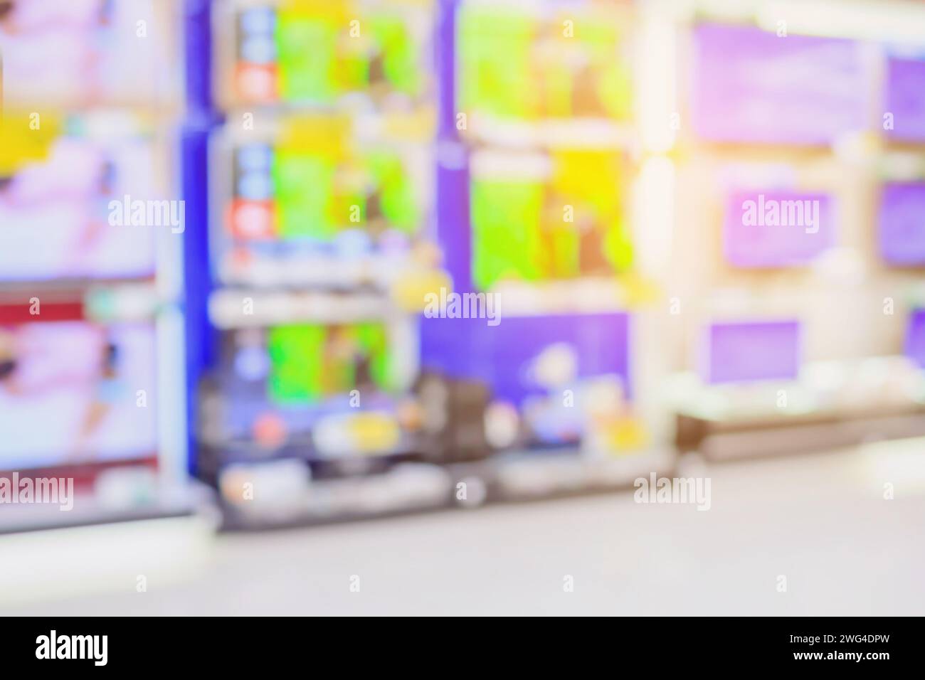 eletronic department store with Television shelves blurred background ...