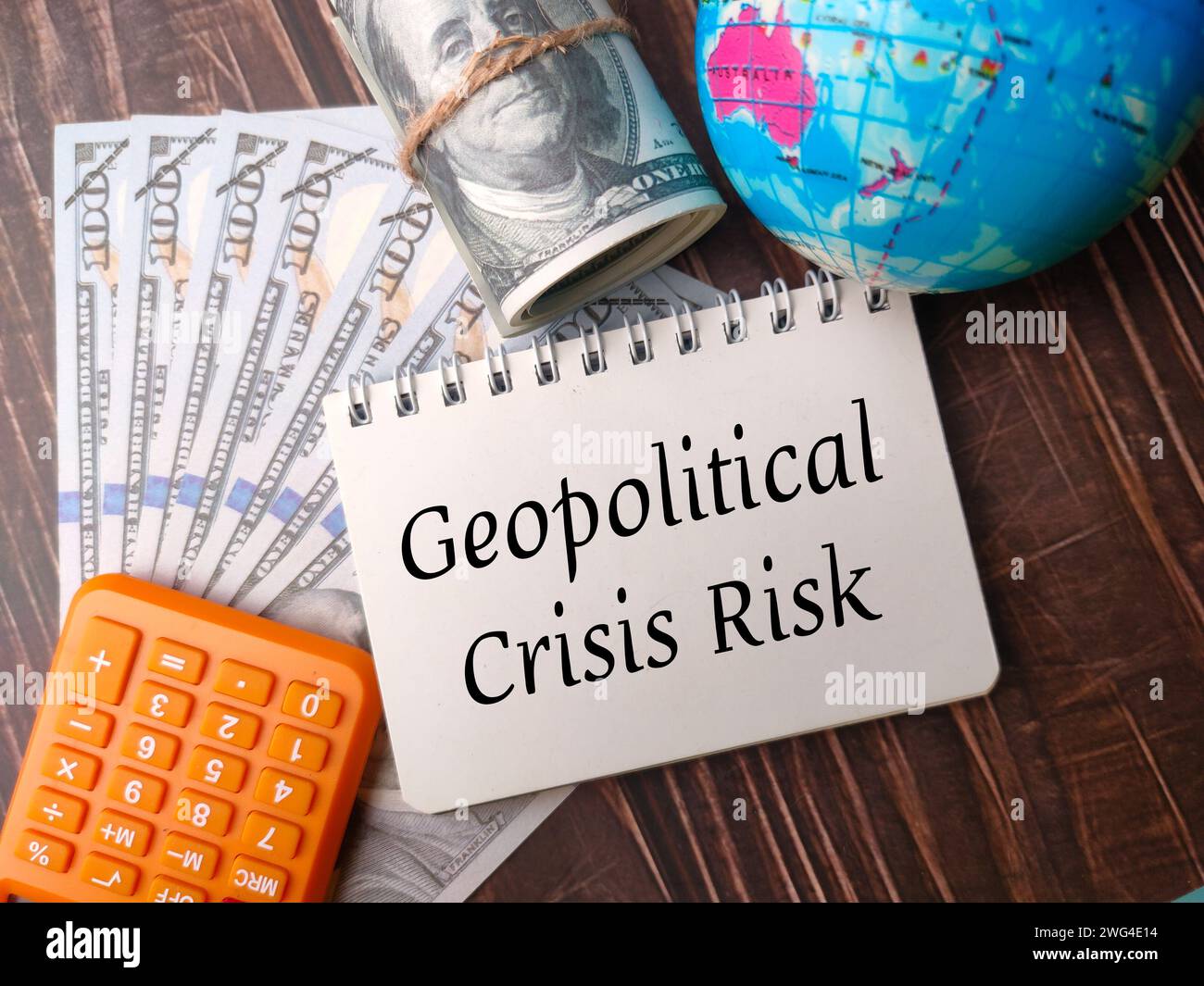 Top view calculator,banknkotes and earth globe with text Geopolitical ...