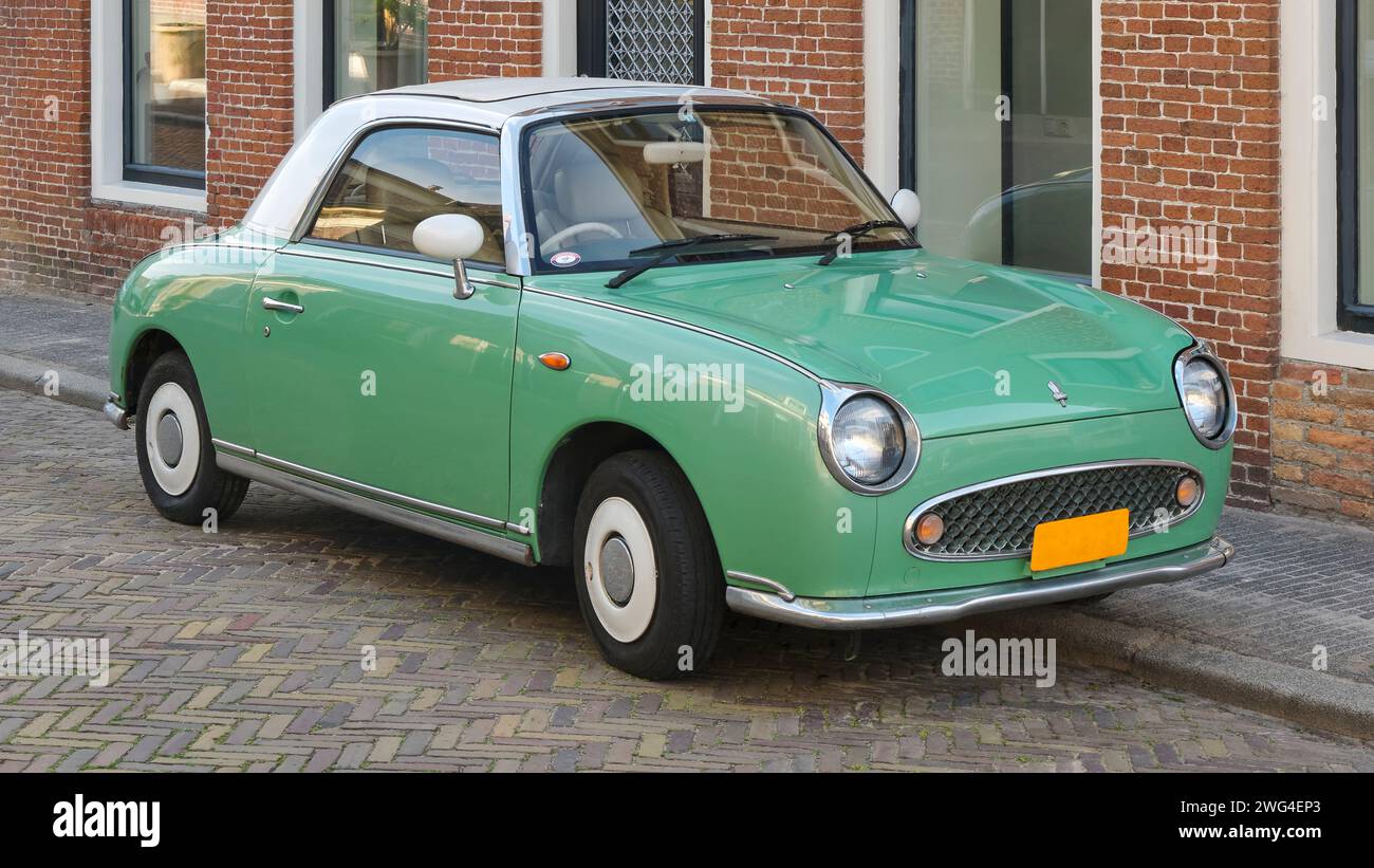 A light green Nissan Figaro in a street in the Netherlands. Only 12000 ...
