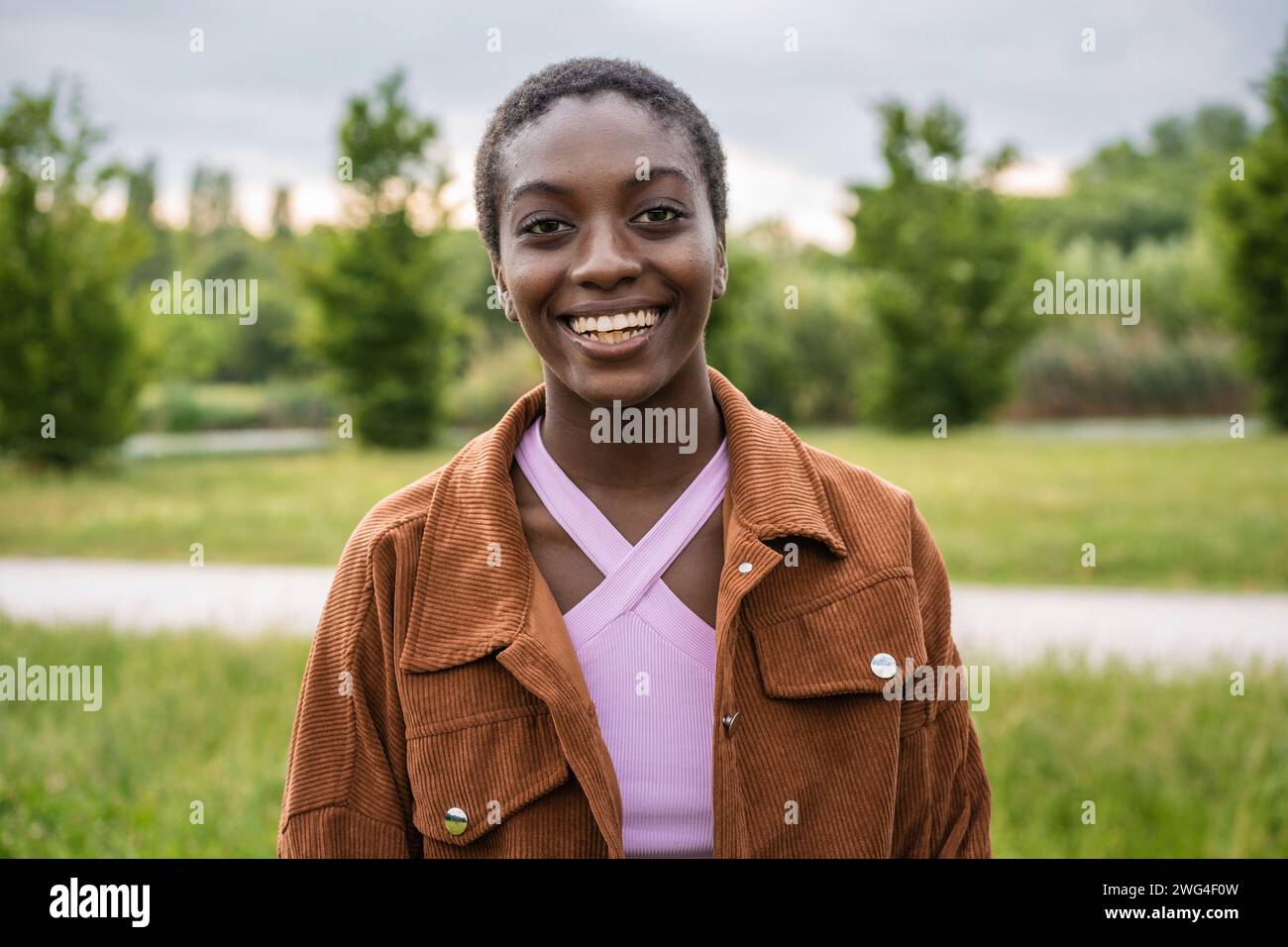 Young African Woman Laughing Outdoors Expressing Happiness With