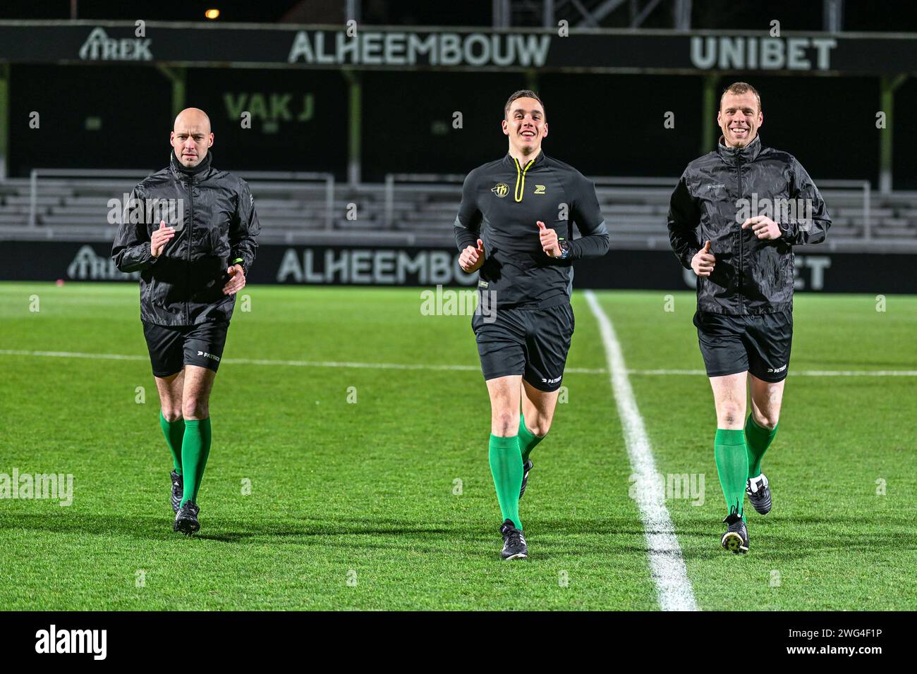 Warming-up assistant referee David Symons , referee Michiel Allaerts ...
