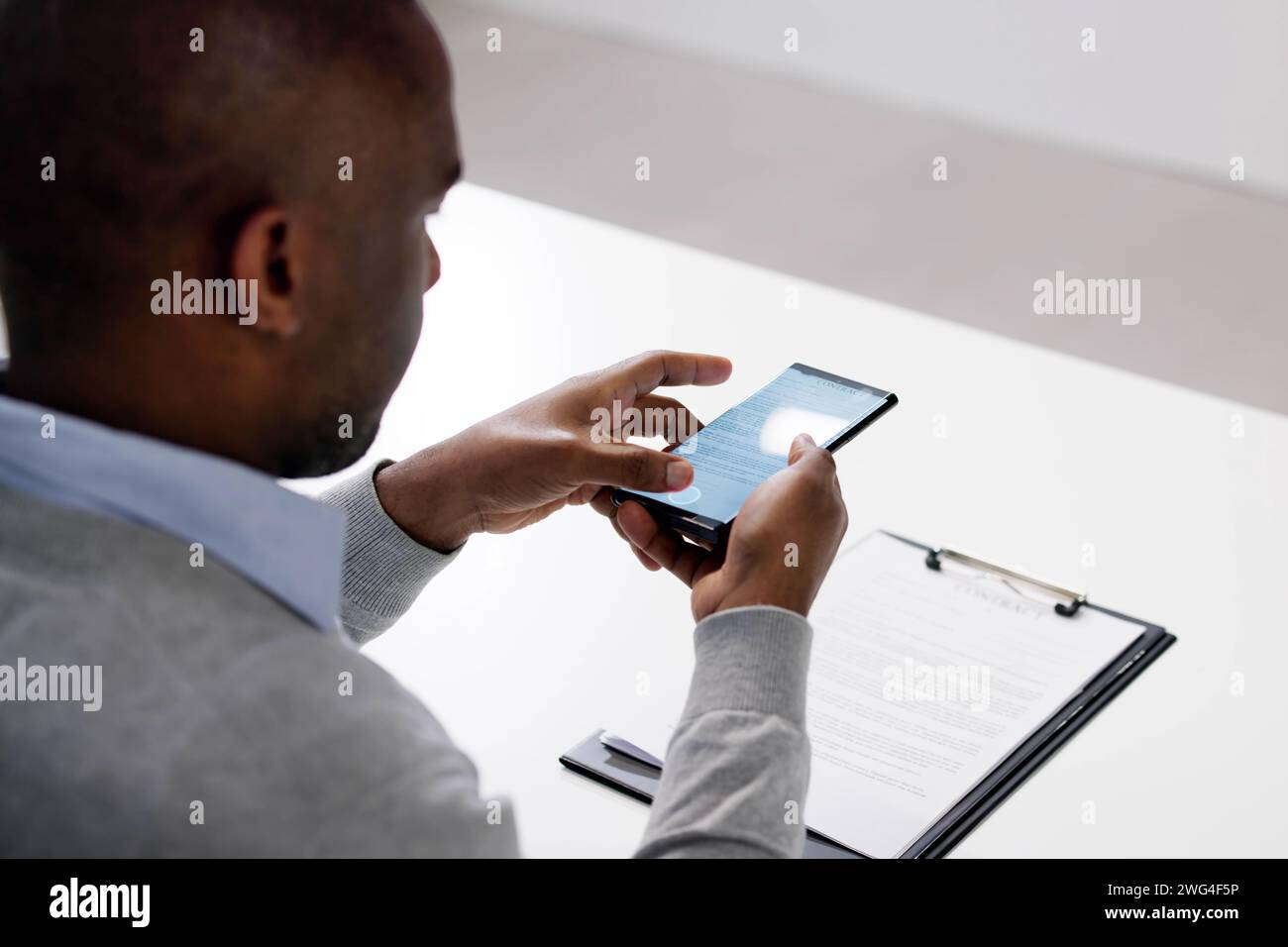 Remote Check Deposit Taking Photo With Mobile Phone Stock Photo - Alamy