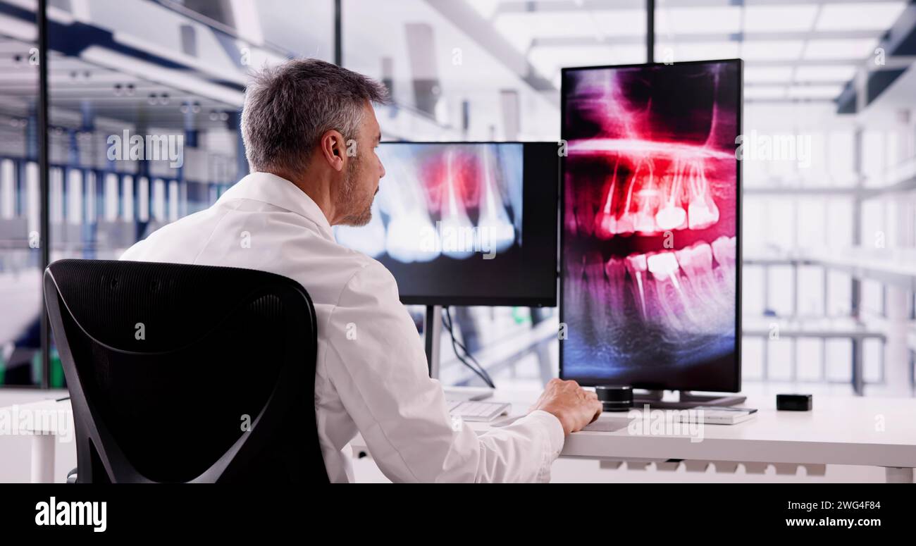 Radiologist Dentist Using X Ray Software On Desktop Computer Stock ...