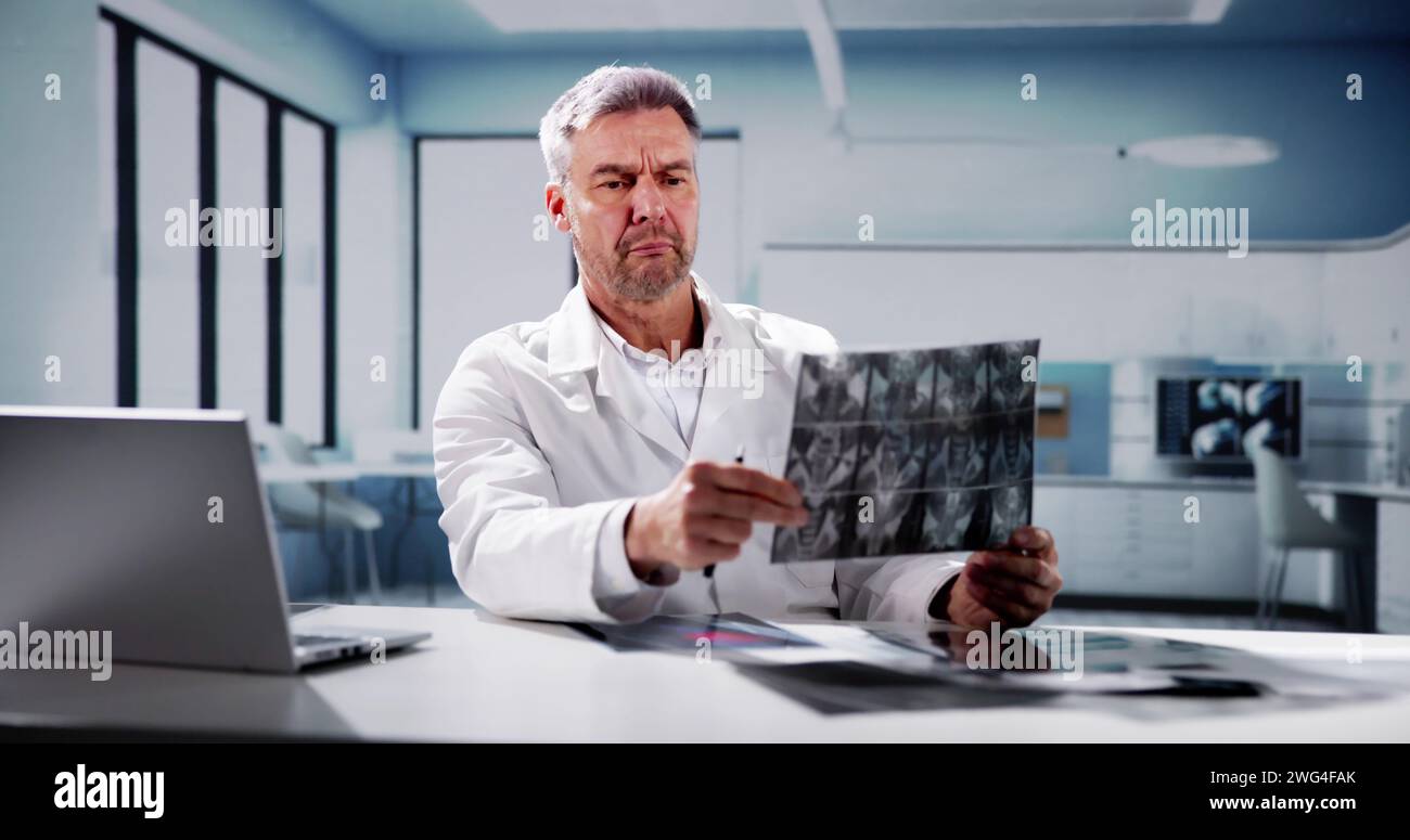 Doctor Screening Spine Bones X Ray In Office Stock Photo - Alamy